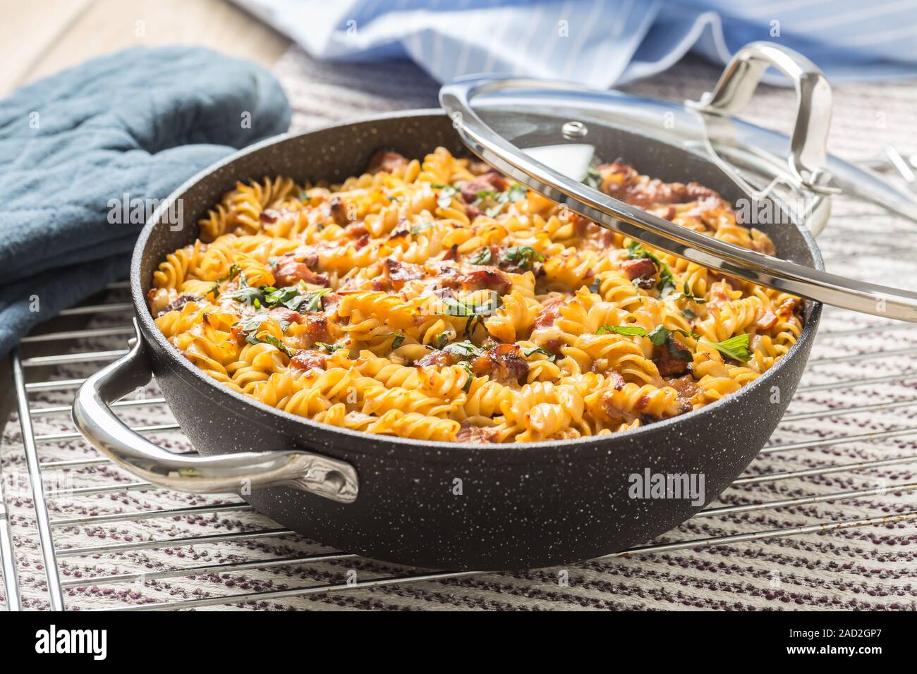Baked pasta fusilli with smoked pork neck mozzarela cheese and othe ...