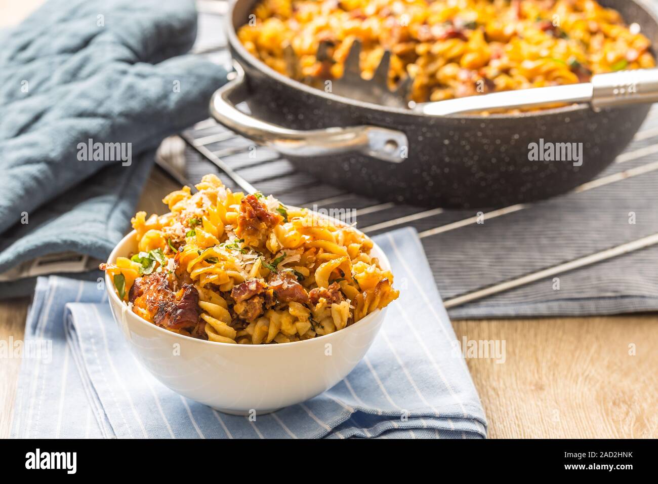 Baked pasta fusilli with smoked pork neck mozzarela cheese and othe ...