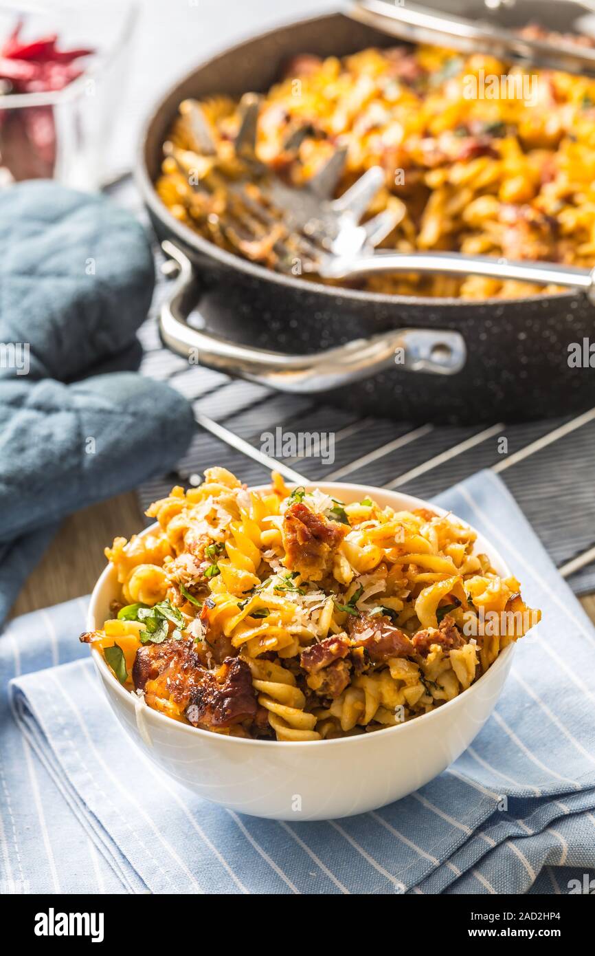 Baked pasta fusilli with smoked pork neck mozzarela cheese and othe ...