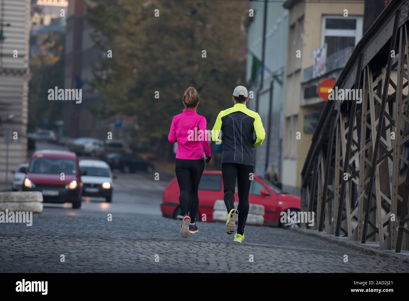 young couple jogging Stock Photo - Alamy