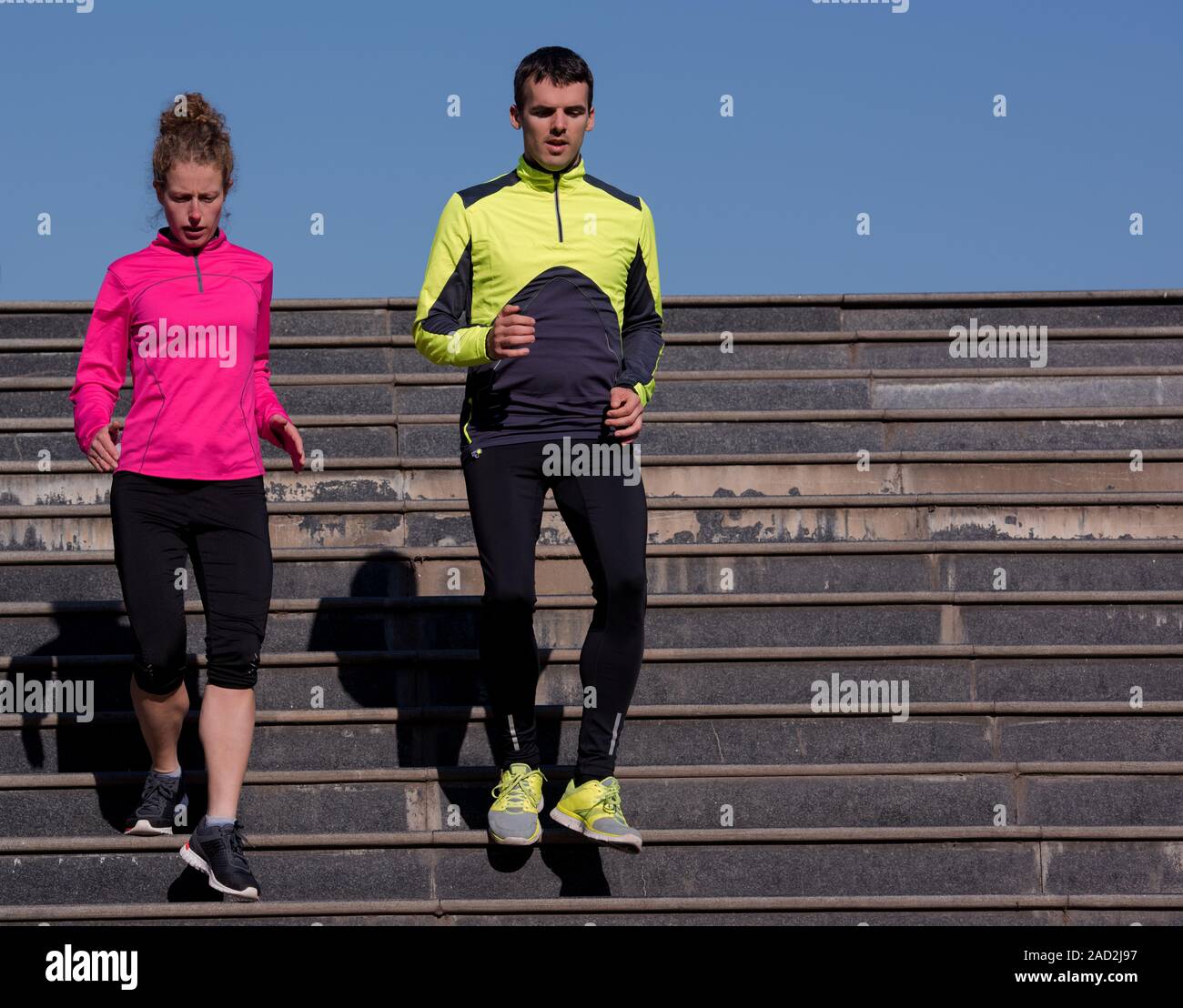 young couple jogging on steps Stock Photo - Alamy