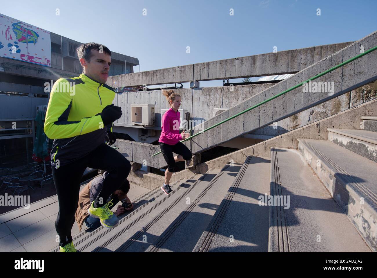 young couple jogging on steps Stock Photo - Alamy
