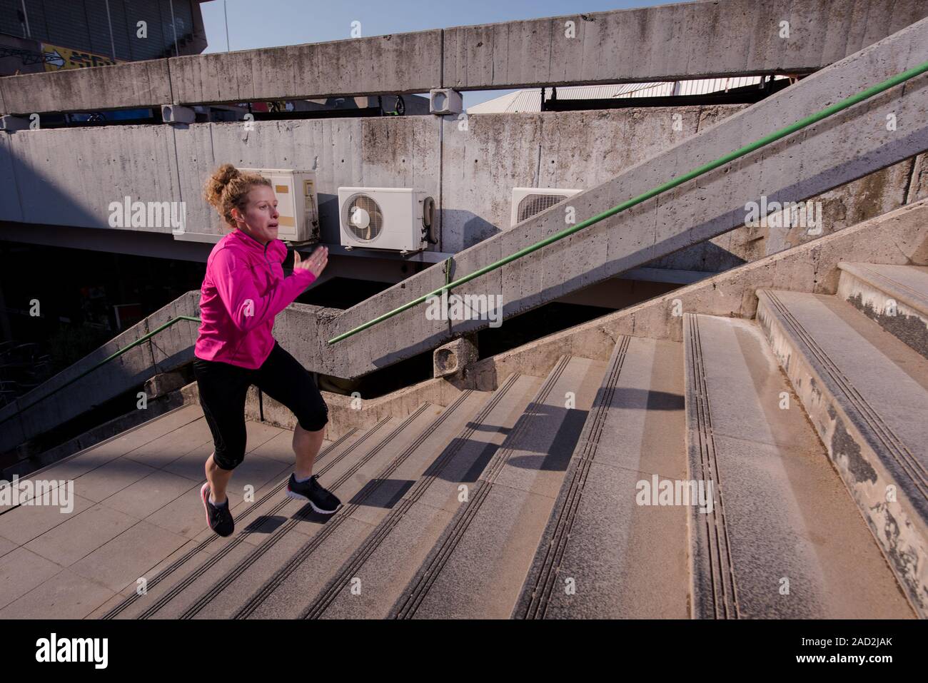 woman jogging on steps Stock Photo - Alamy