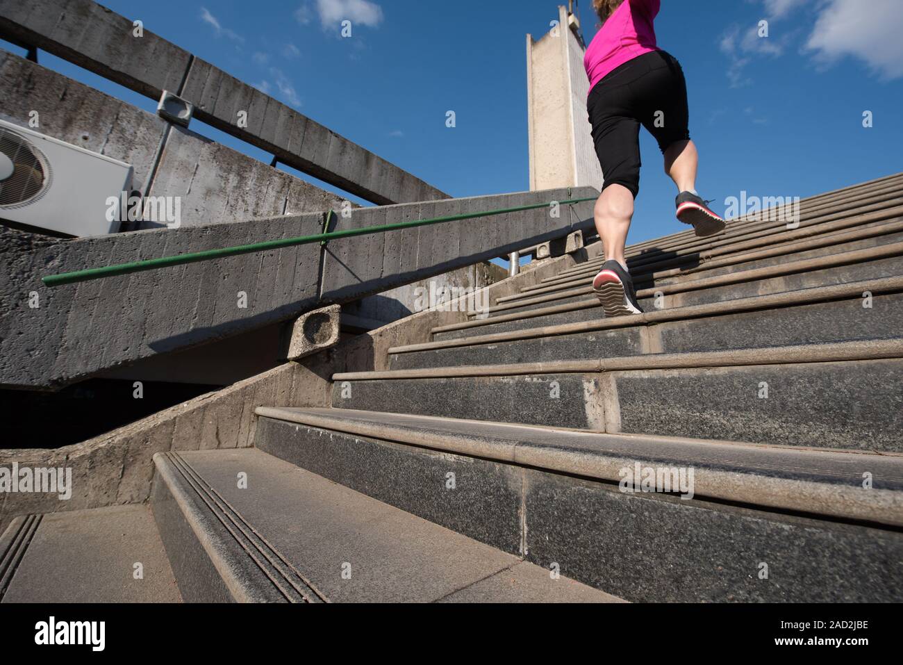 woman jogging on steps Stock Photo - Alamy