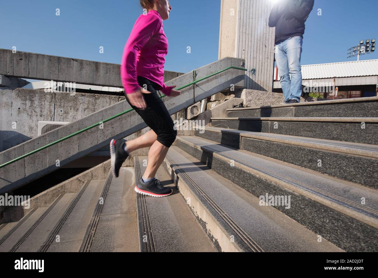 woman jogging on steps Stock Photo - Alamy