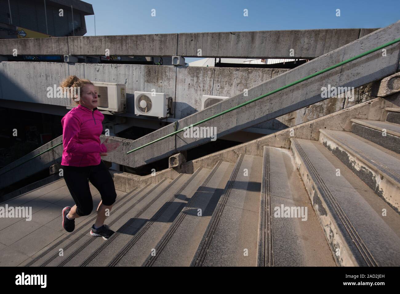 woman jogging on steps Stock Photo - Alamy