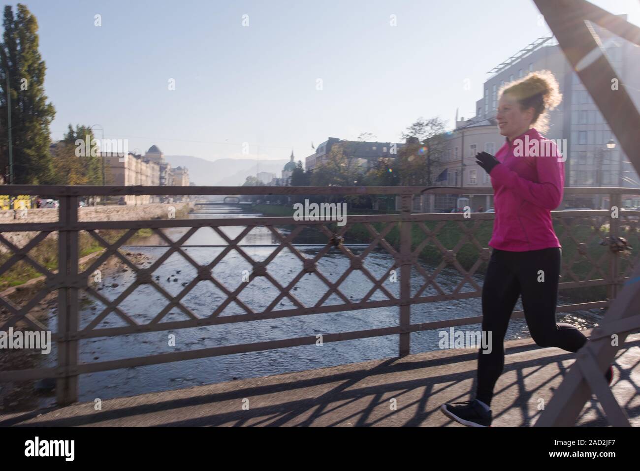 sporty woman jogging on morning Stock Photo - Alamy