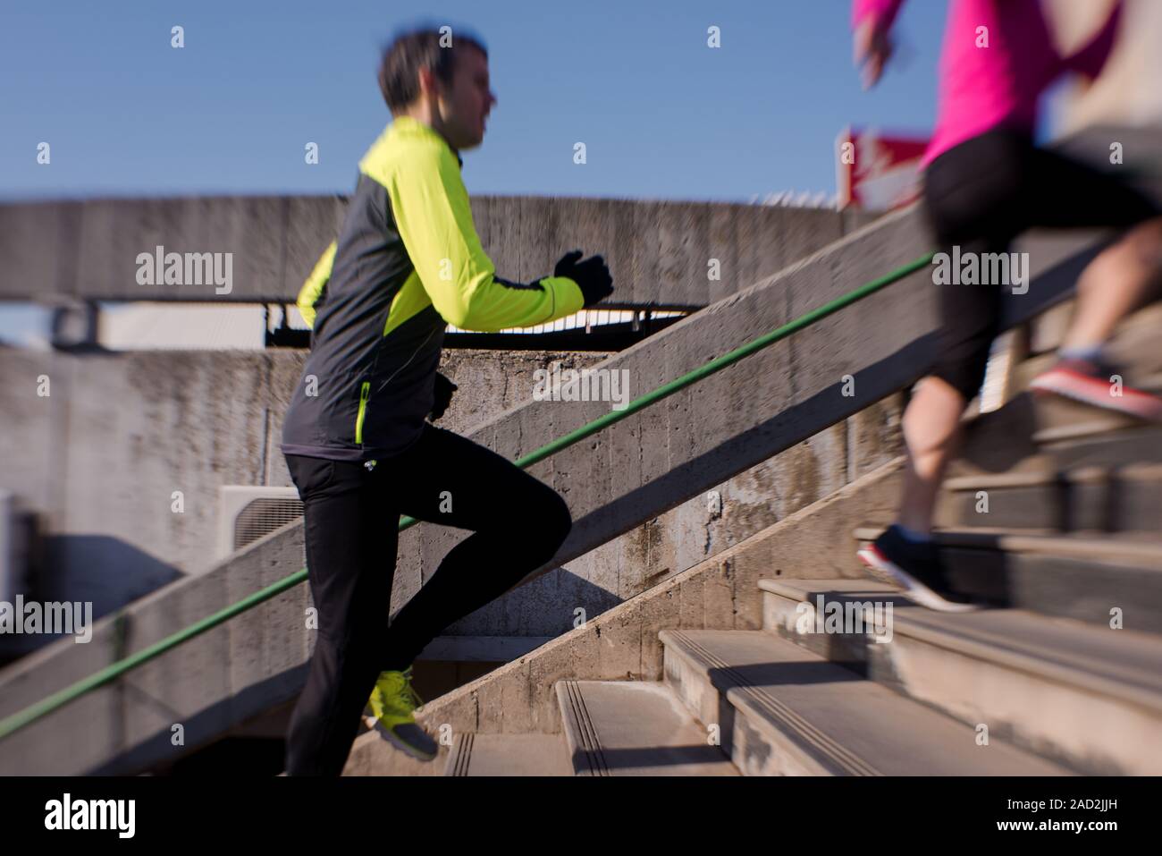 young couple jogging on steps Stock Photo - Alamy