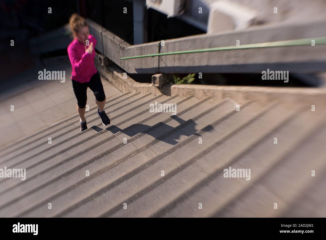 woman jogging on steps Stock Photo - Alamy