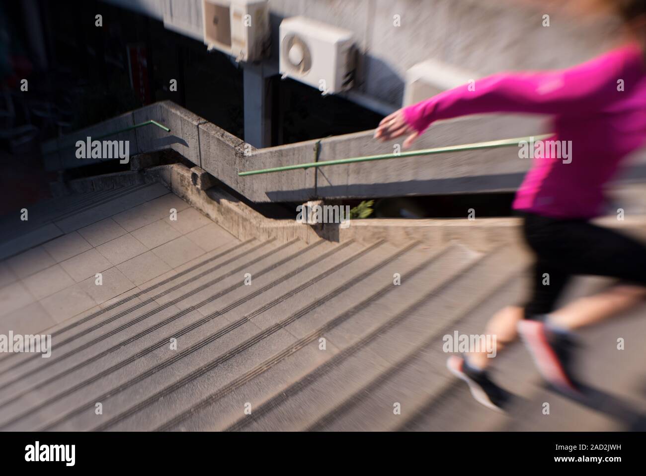 woman jogging on steps Stock Photo - Alamy