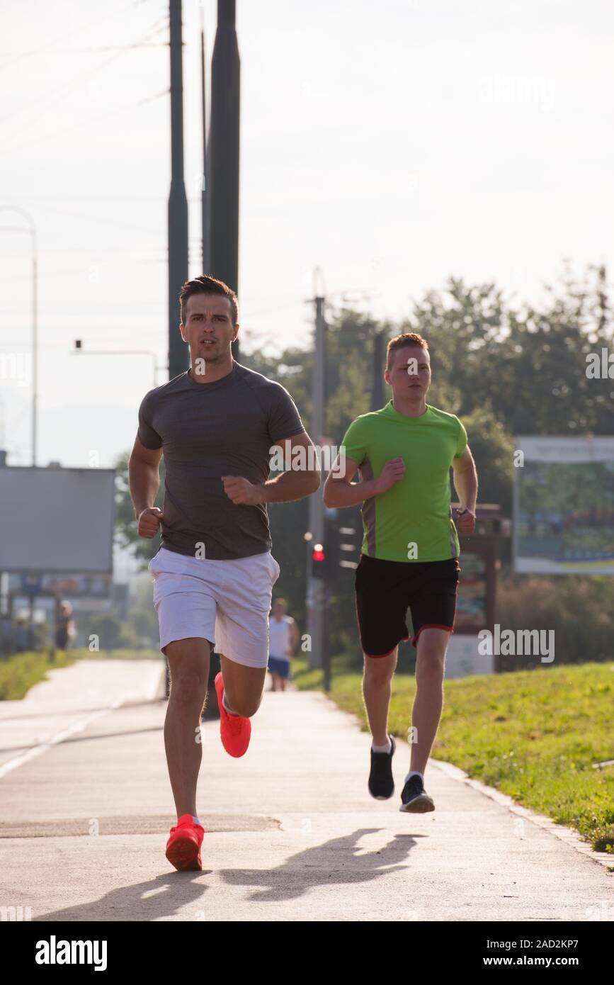 Two young men jogging through the city Stock Photo - Alamy Two young men jogging through the city Stock Photo - Alamy