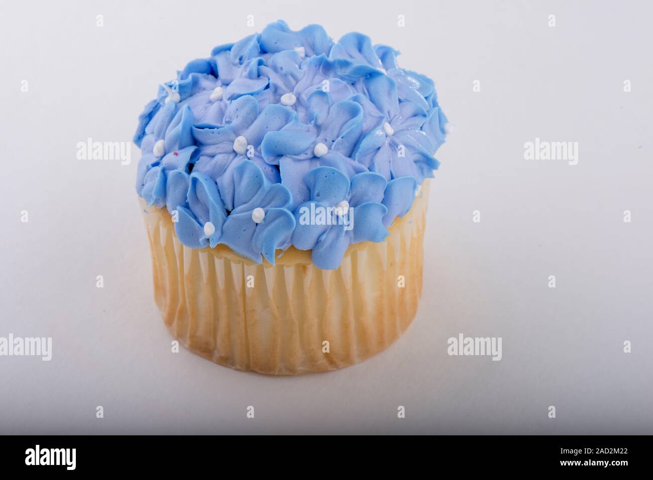 Blue Frosted Vanilla Cupcake with edible pearl decorations Stock Photo ...