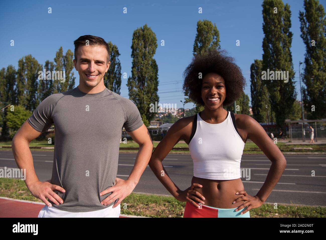 Portrait of romantic pretty couple on fitness session, outside town ...
