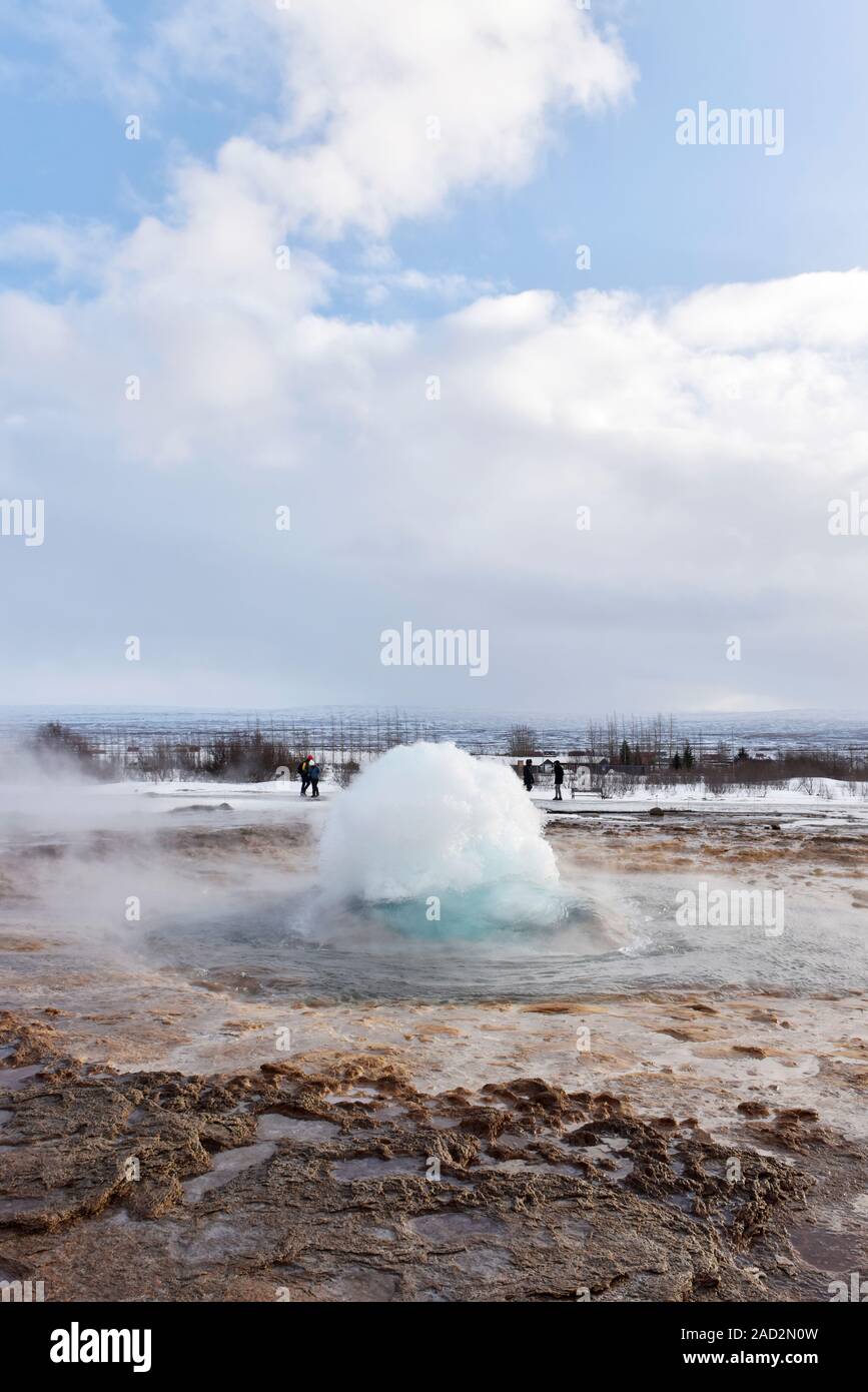 Strokkur Geyser erupting. A geyser is a deep natural well in a ...