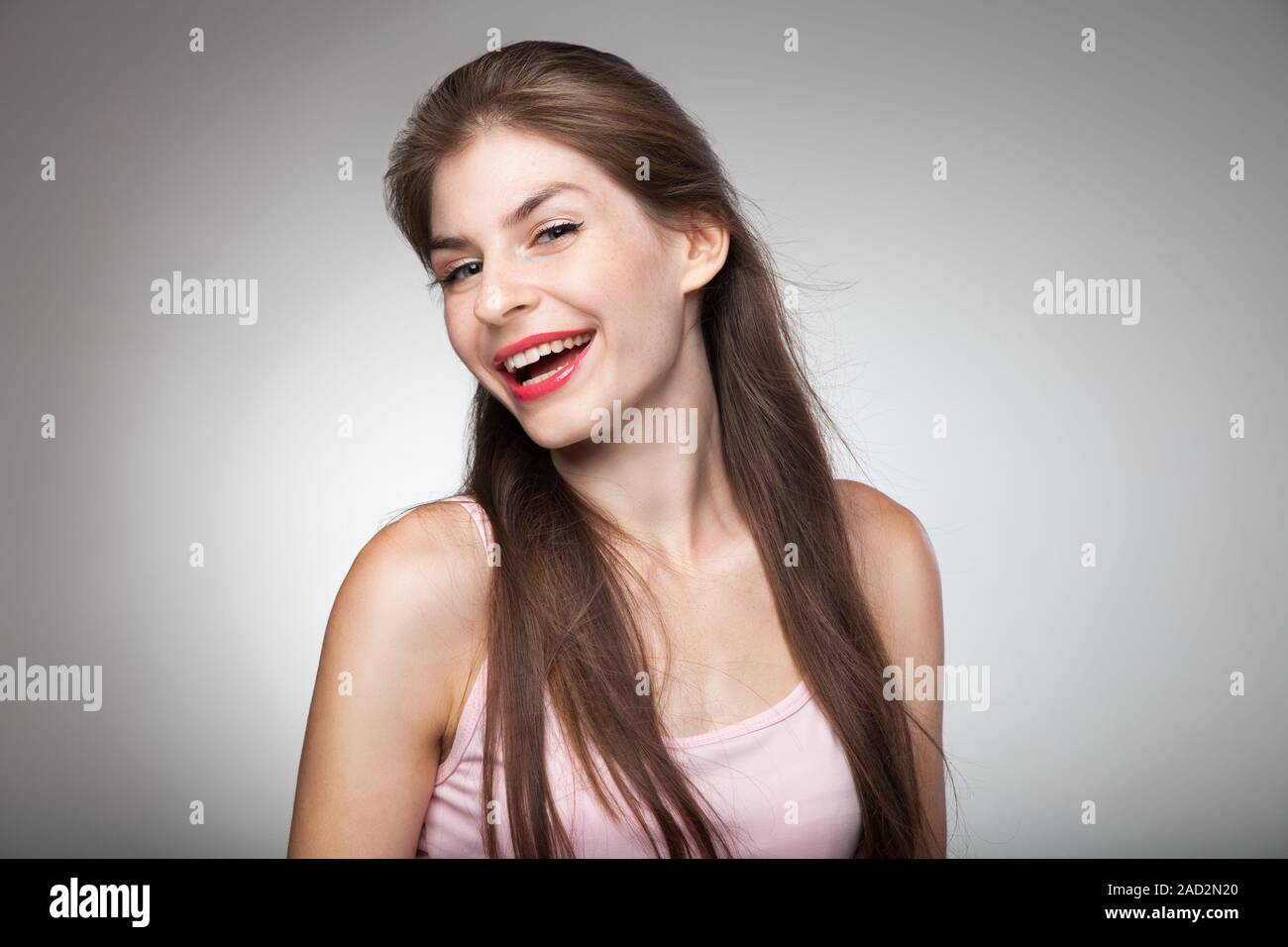Portrait of smiling girl posing at camera Stock Photo - Alamy