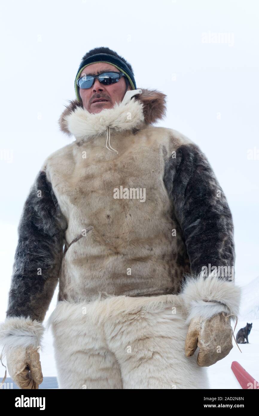 Inuit hunter. Traditional winter-spring fur clothing worn by an Inuit ...