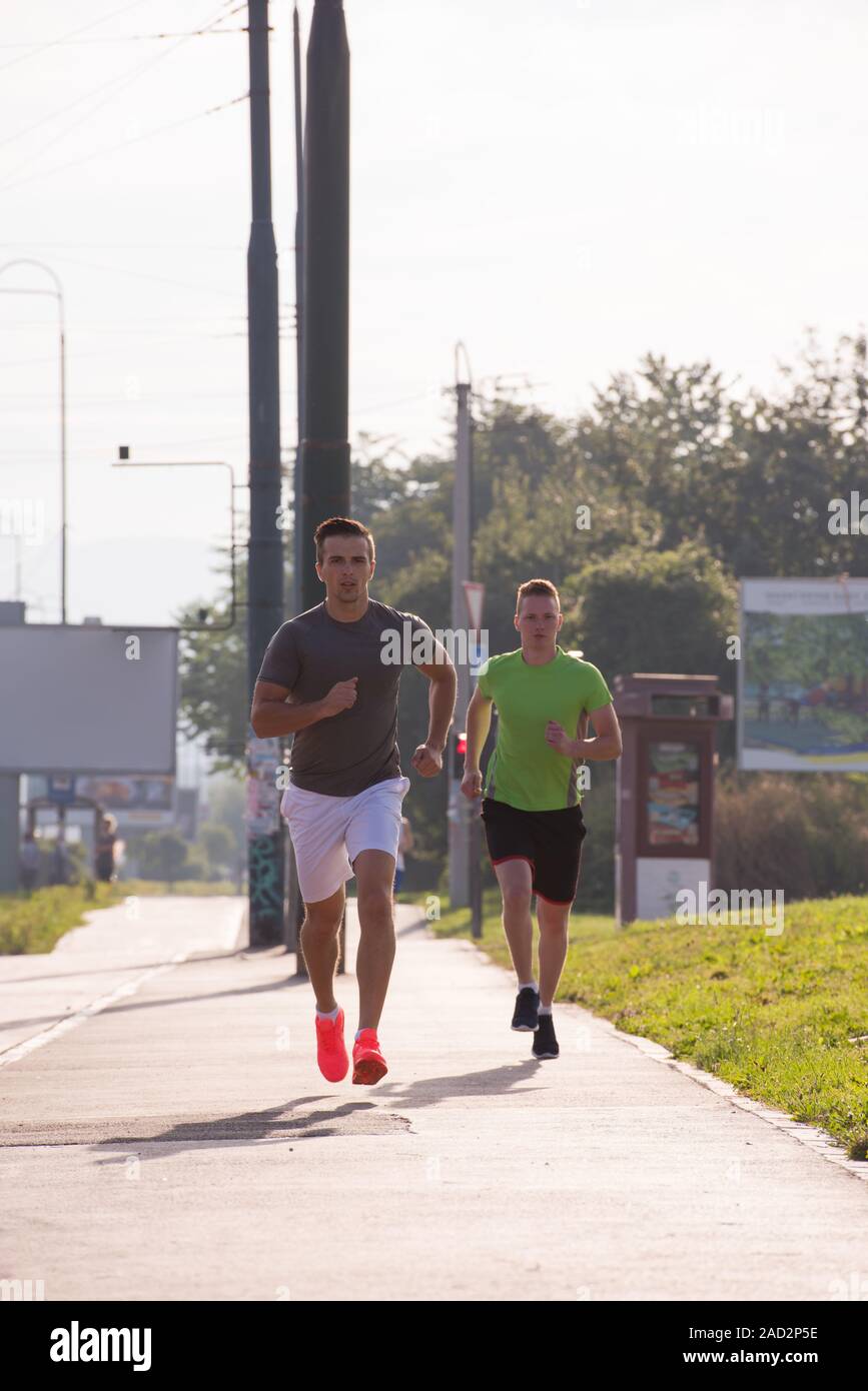 Two young men jogging through the city Stock Photo - Alamy Two young men jogging through the city Stock Photo - Alamy