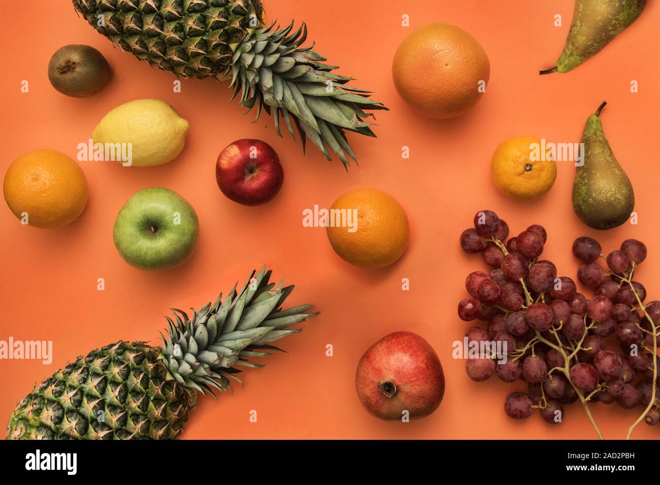 Different fruits on bright color background Stock Photo - Alamy