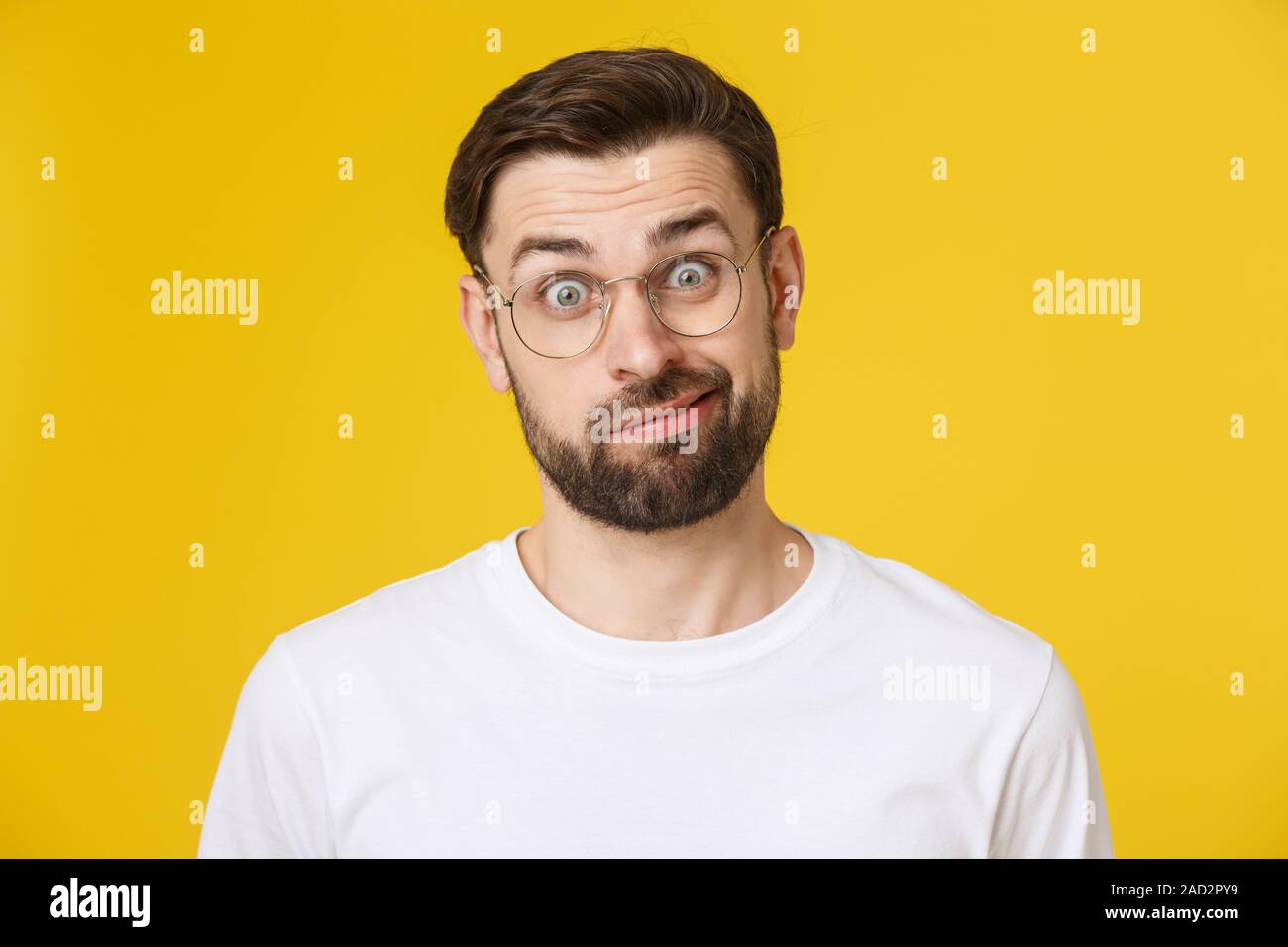 Young casual man portrait isolated on yellow background Stock Photo - Alamy
