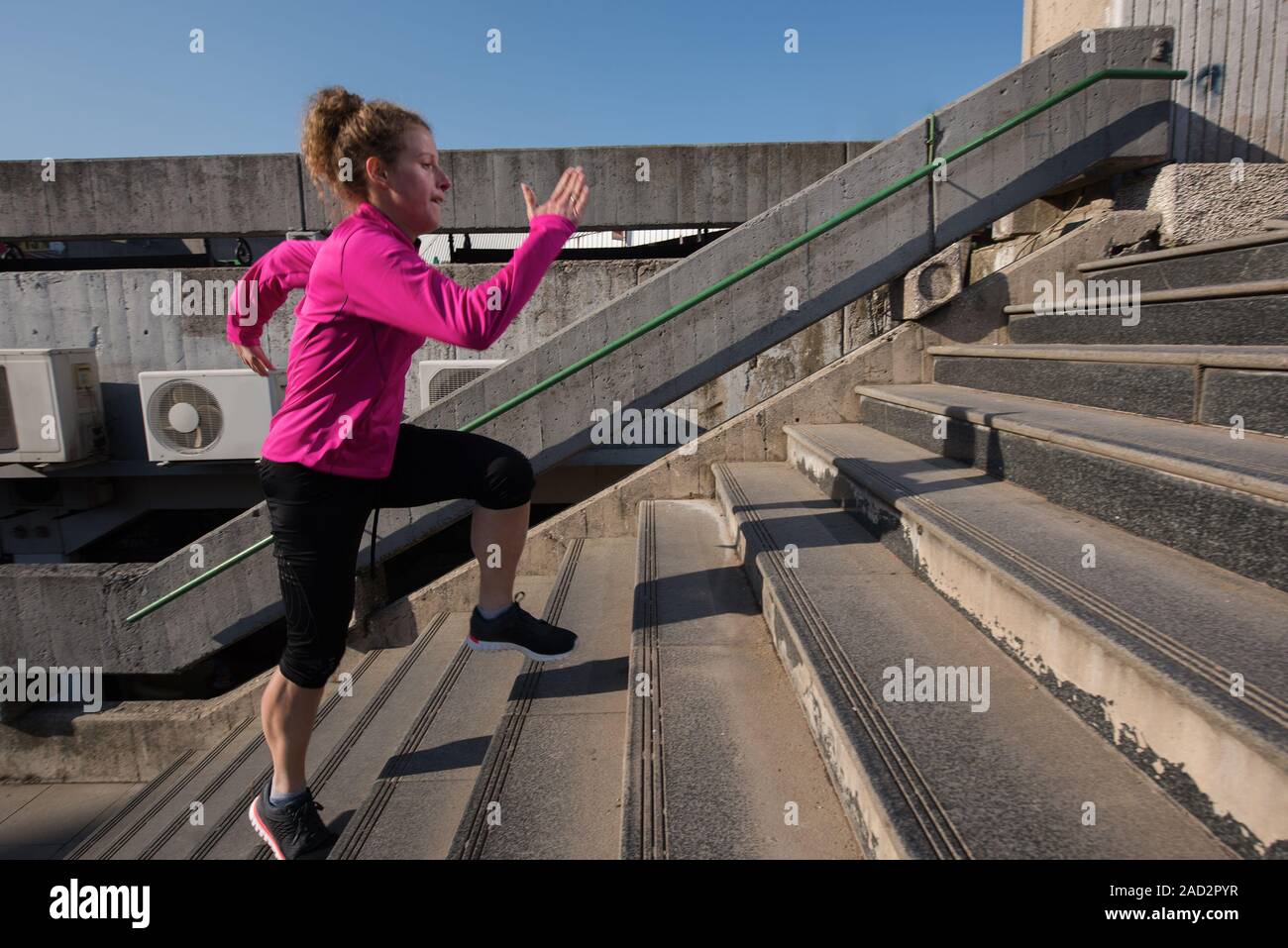 woman jogging on steps Stock Photo - Alamy