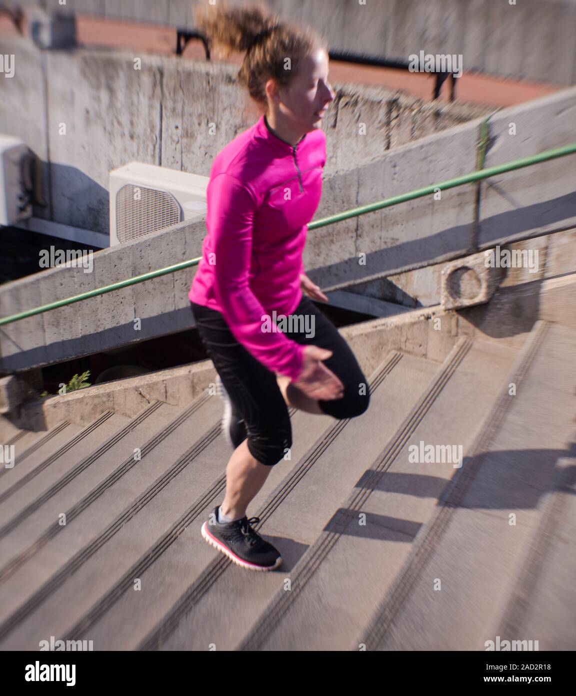 woman jogging on steps Stock Photo - Alamy