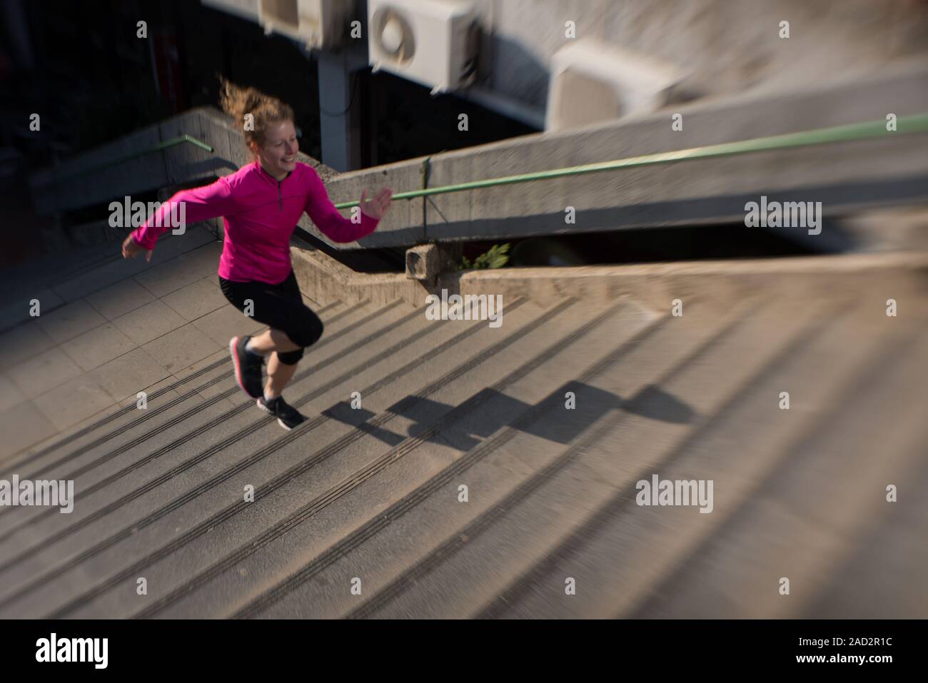 woman jogging on steps Stock Photo - Alamy