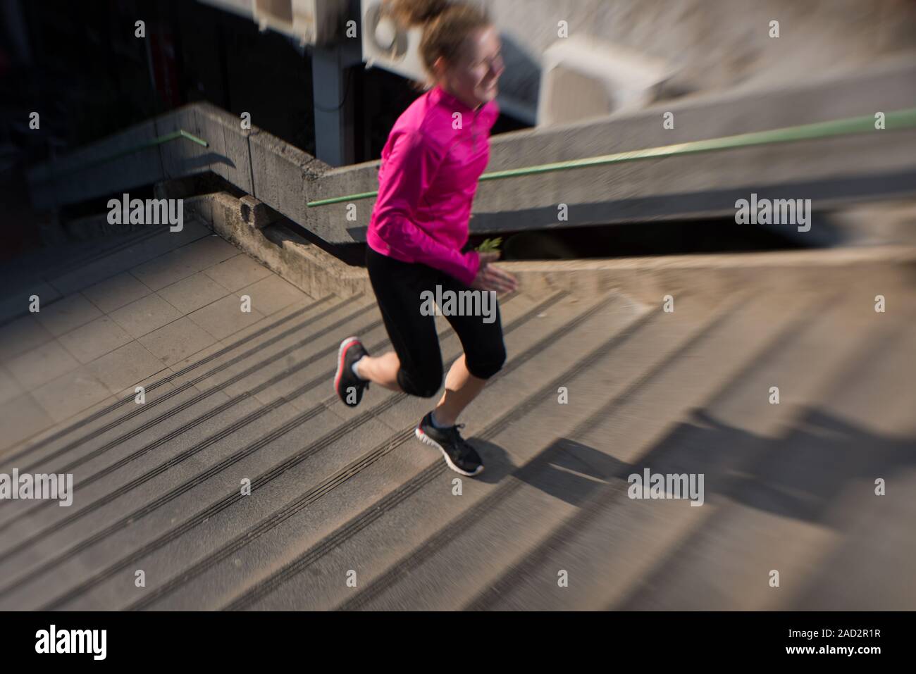 woman jogging on steps Stock Photo - Alamy