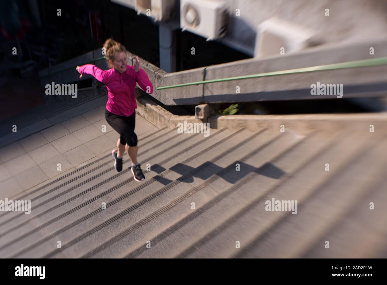 woman jogging on steps Stock Photo - Alamy