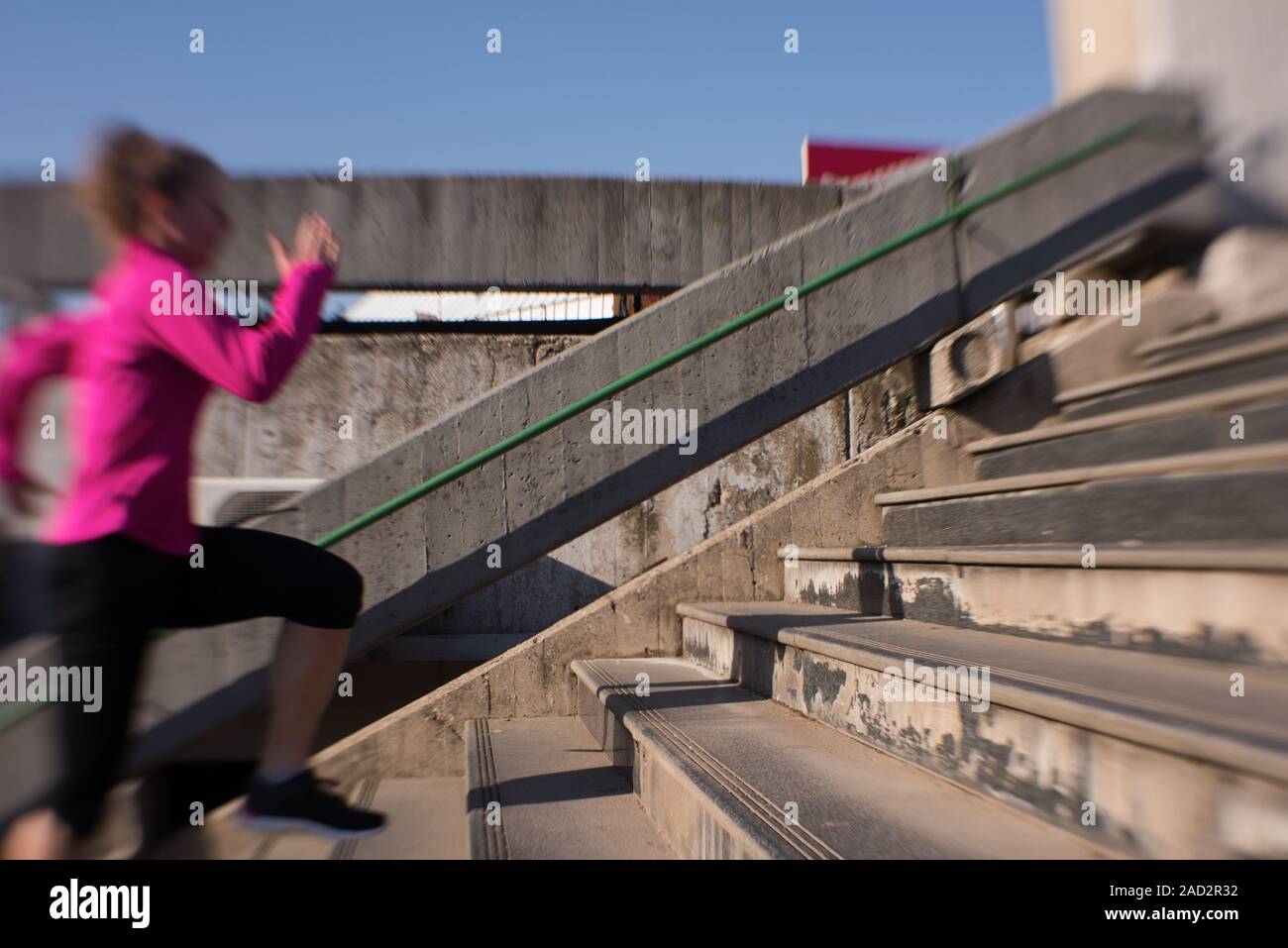 woman jogging on steps Stock Photo - Alamy