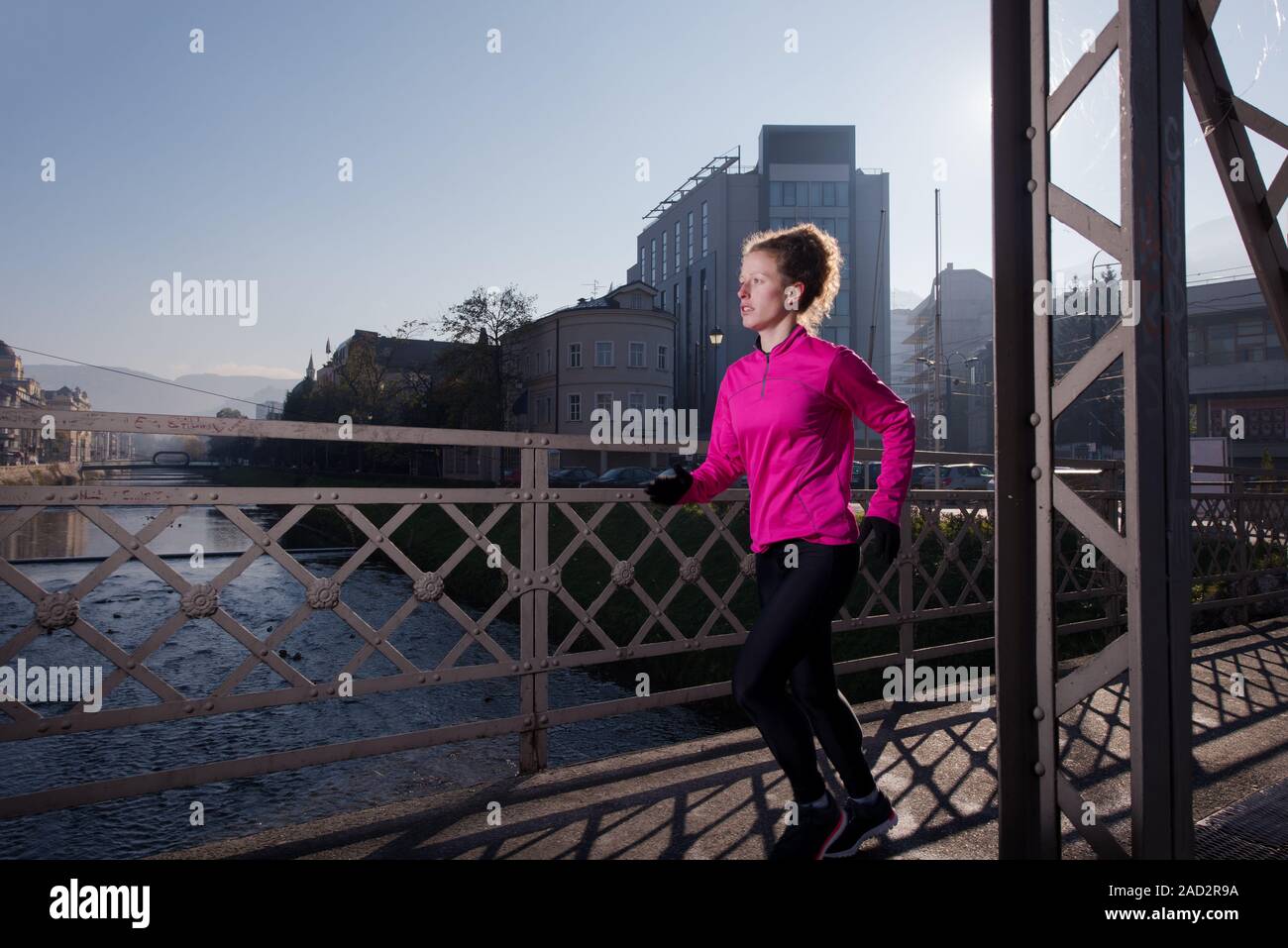 sporty woman jogging on morning Stock Photo - Alamy