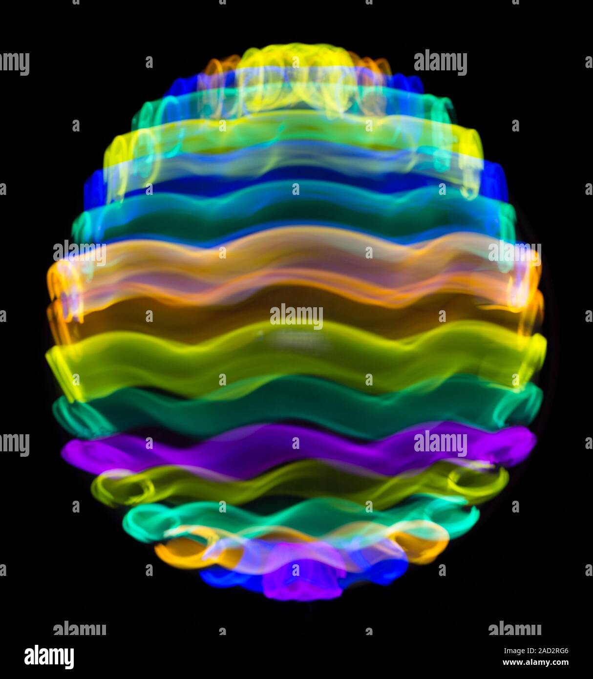 Multicoloured spinning light trails Stock Photo - Alamy