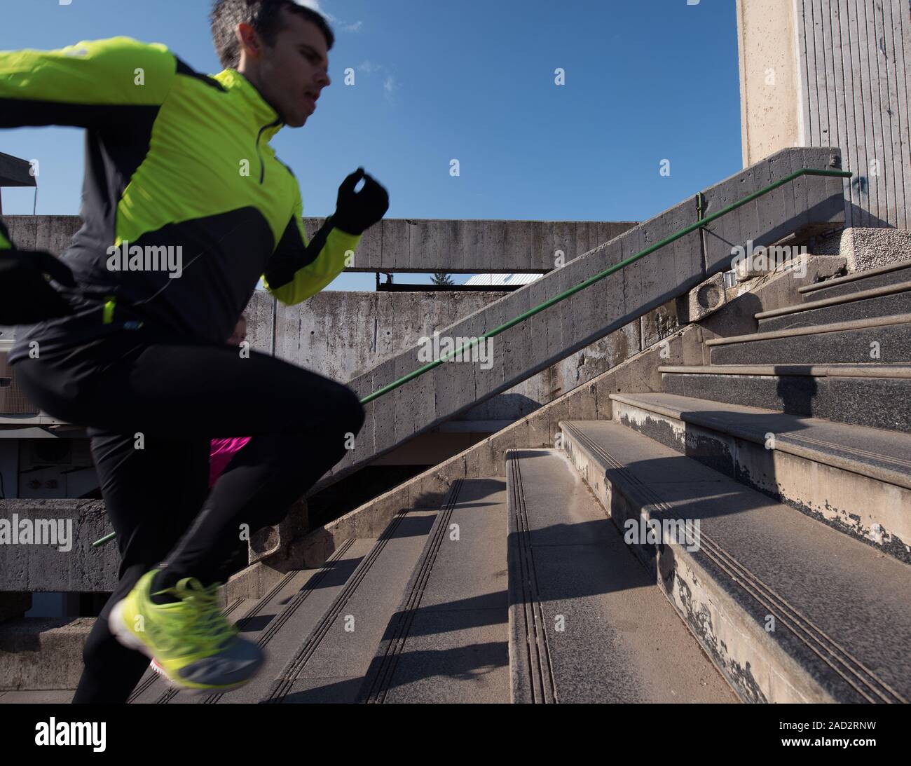 young couple jogging on steps Stock Photo - Alamy