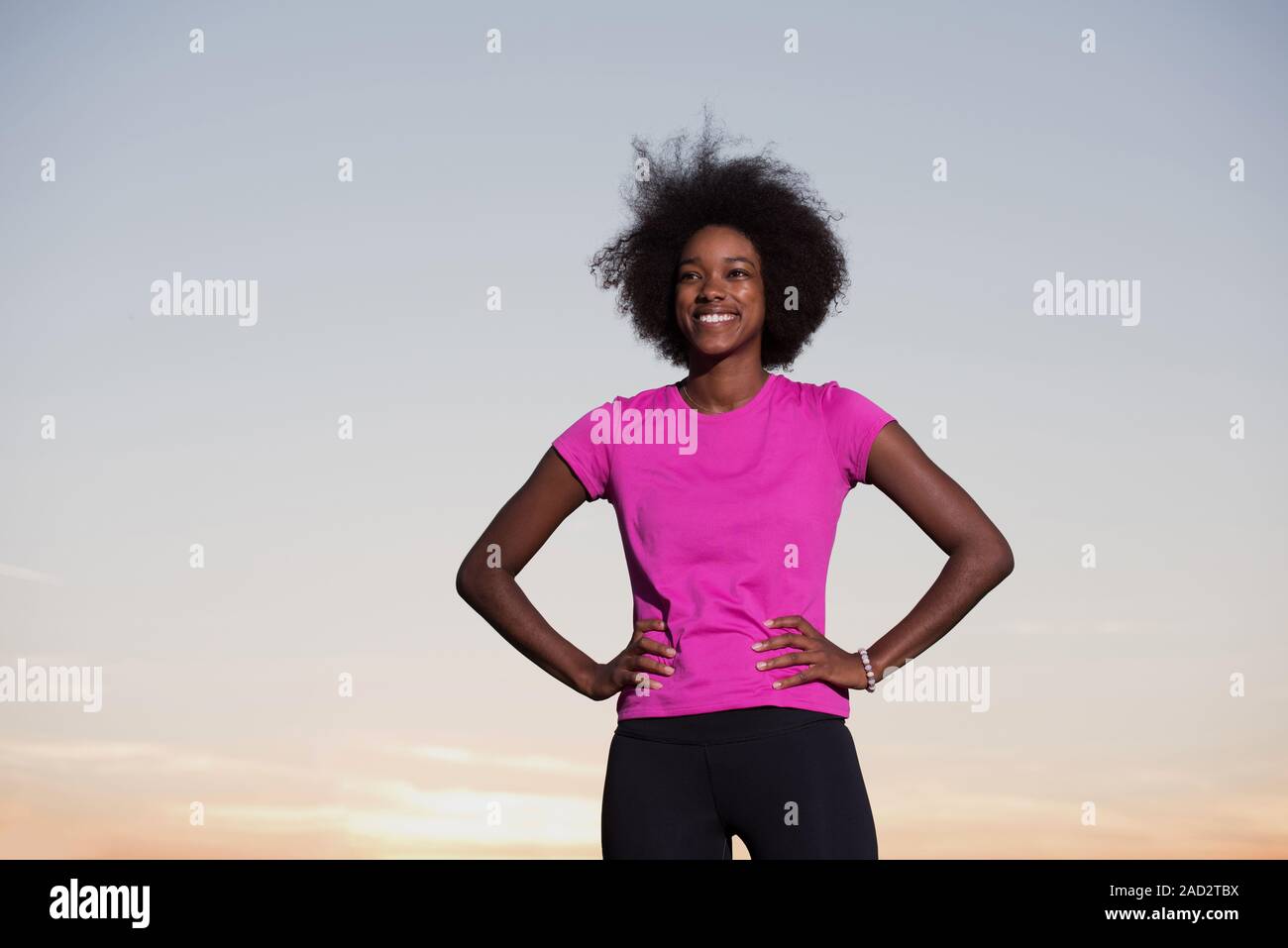 Portrait of a young african american woman running outdoors Stock Photo ...