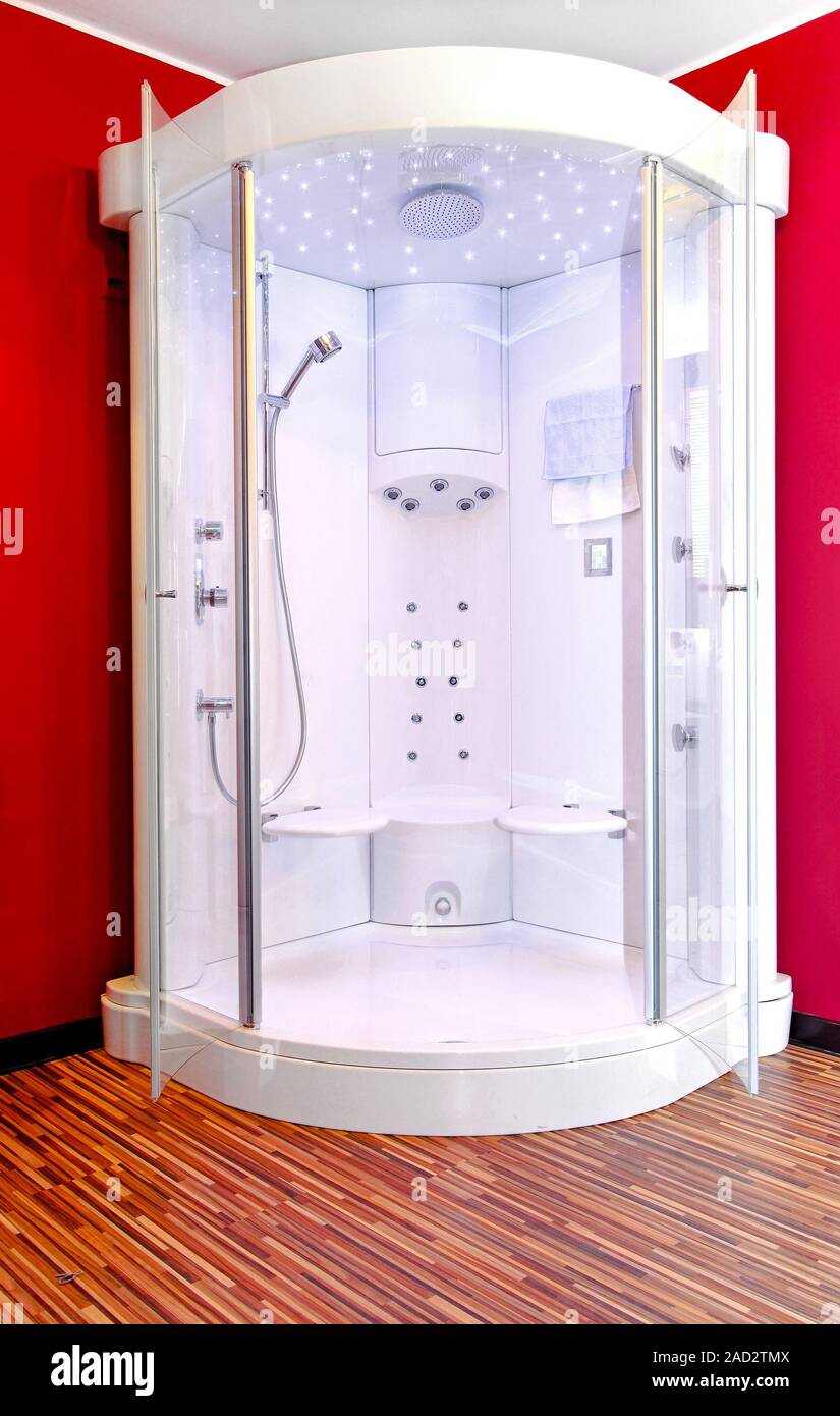 Modern and big shower cabin in bathroom corner Stock Photo - Alamy