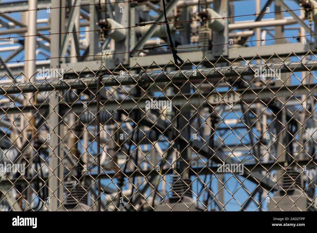 close up view on the exterior electric metal fence of a high voltage ...