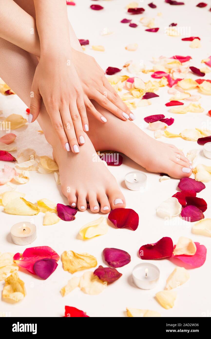 Female gentle hand laying on legs Stock Photo - Alamy