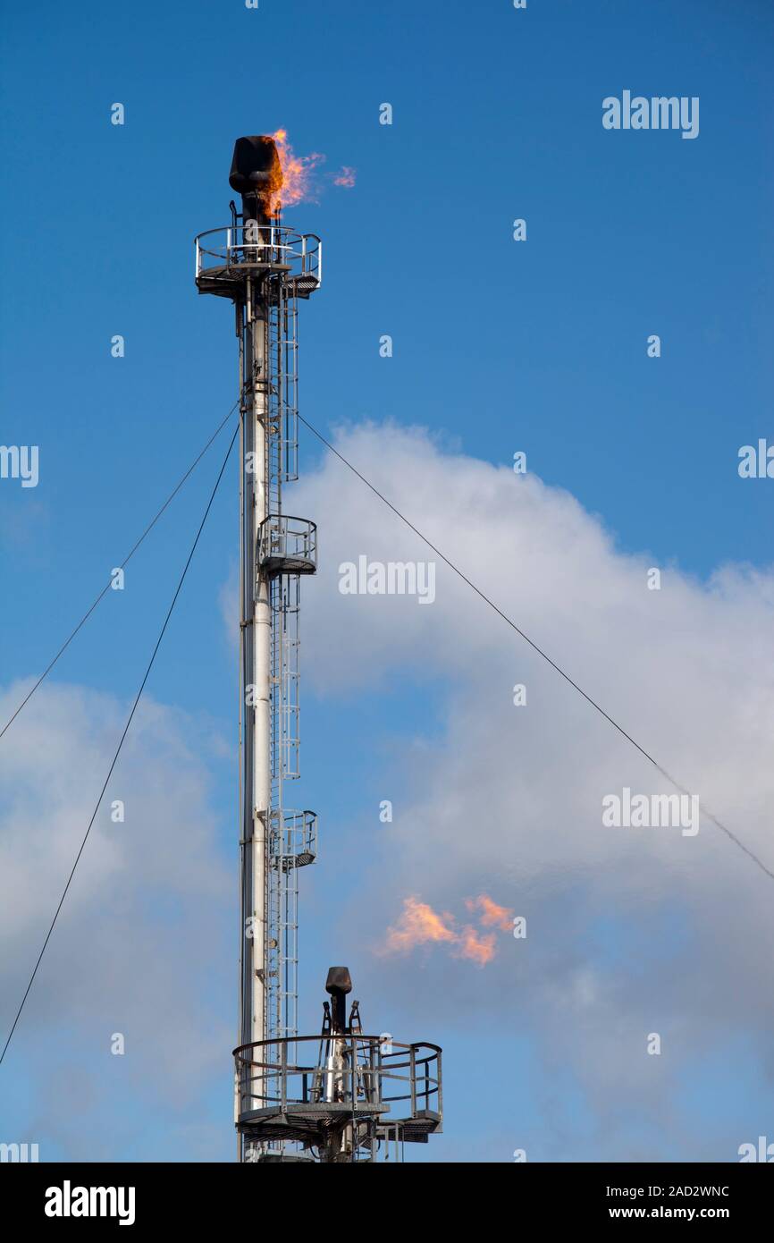 Flaring off gas at a petrochemical works on Teesside, North East, UK ...