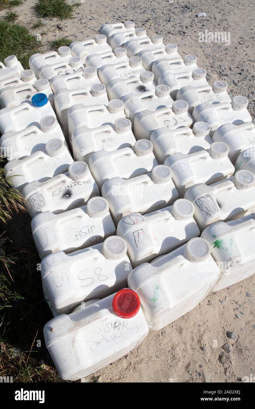Township sanitation. Containers of human waste from government-issued ...