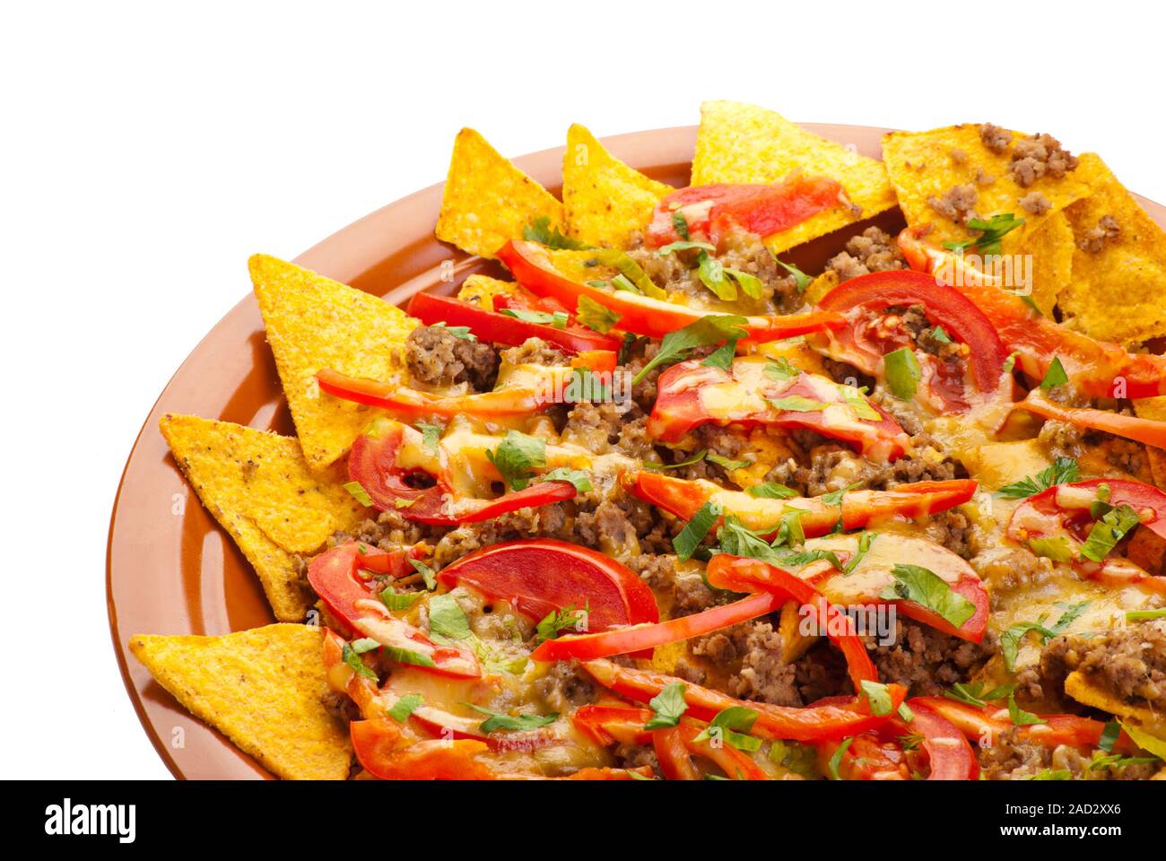 spicy nachos with pork, tomato and pepper Stock Photo - Alamy