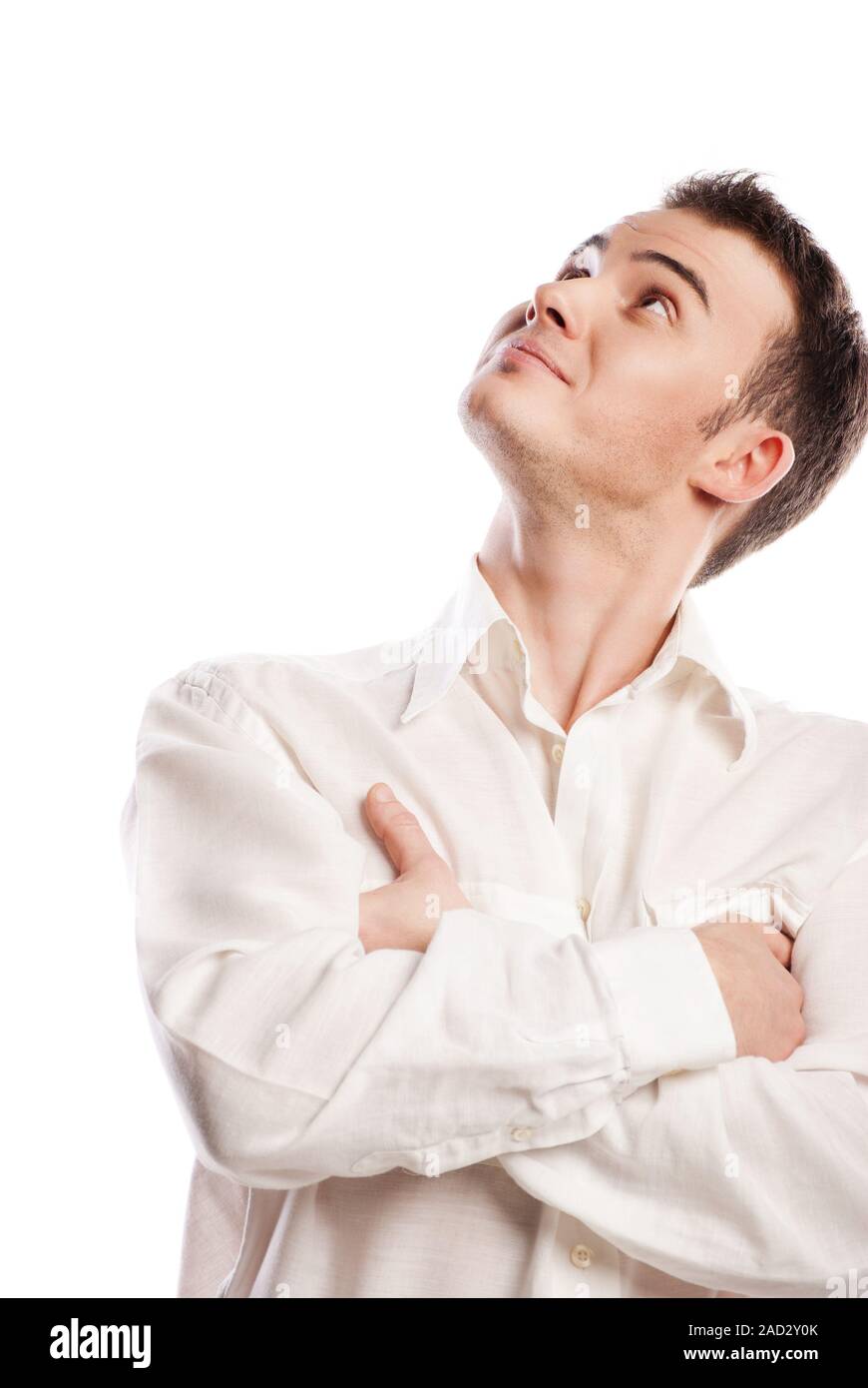 Handsome smiling young man looking up isolated Stock Photo - Alamy