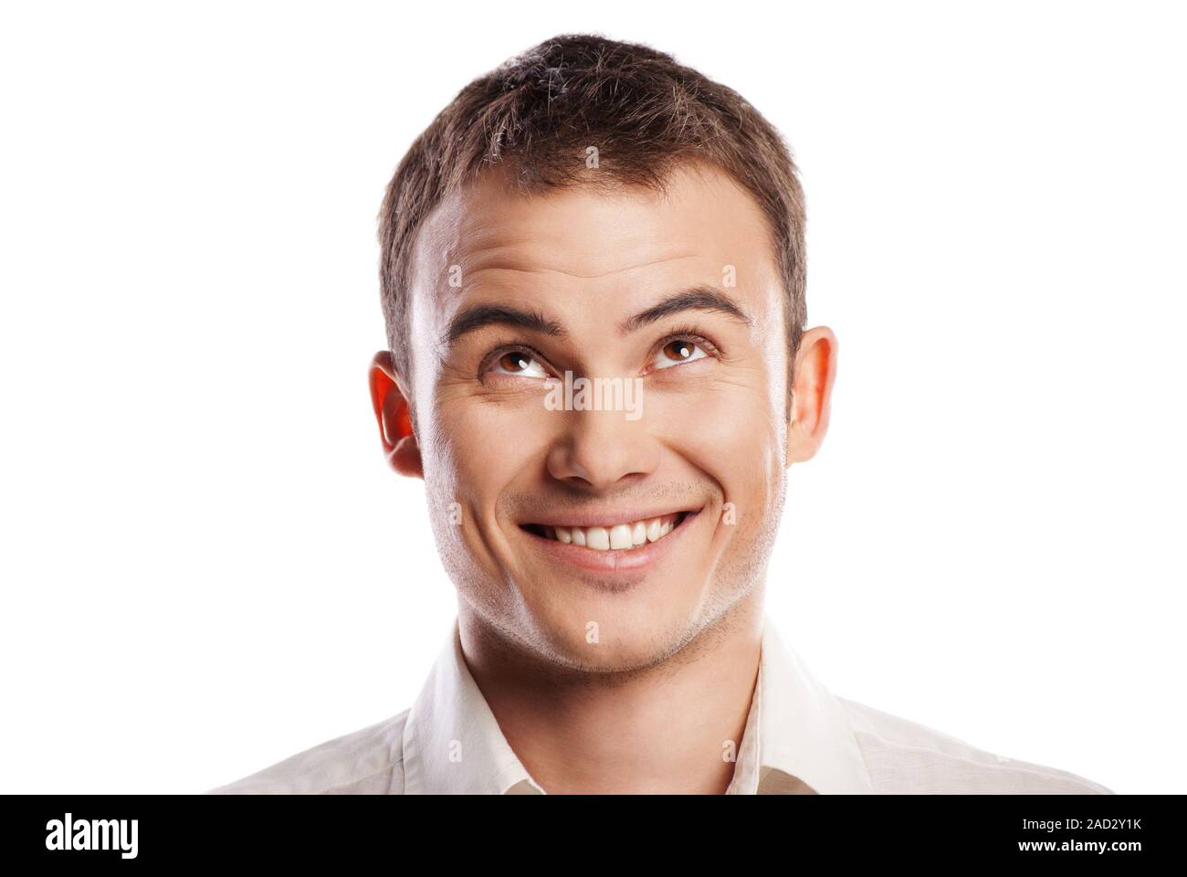 Handsome smiling young man looking up isolated Stock Photo - Alamy Handsome smiling young man looking up isolated Stock Photo - Alamy