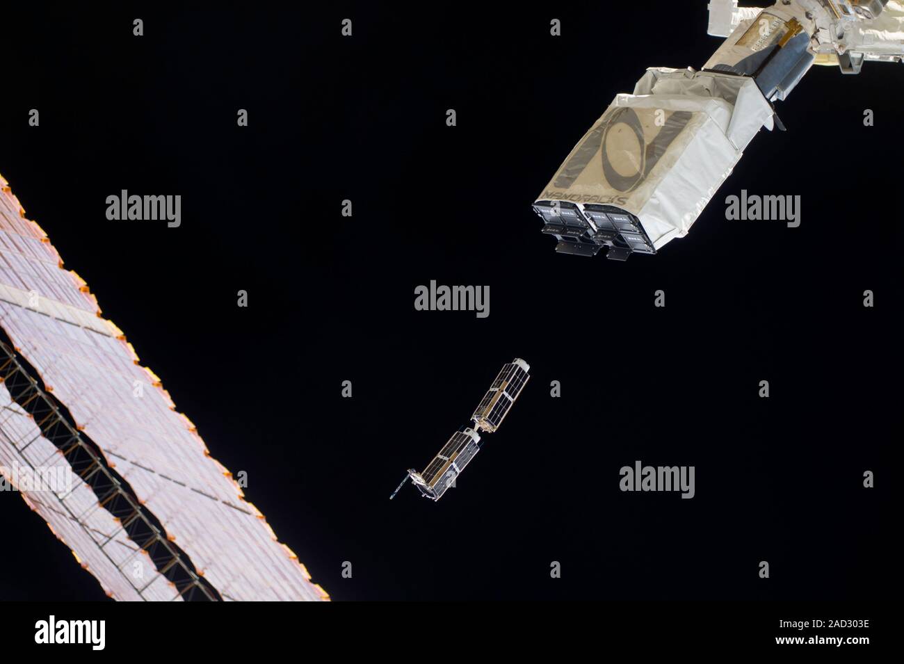 ISS deploying satellites. Astronaut photograph of NanoRacks ...