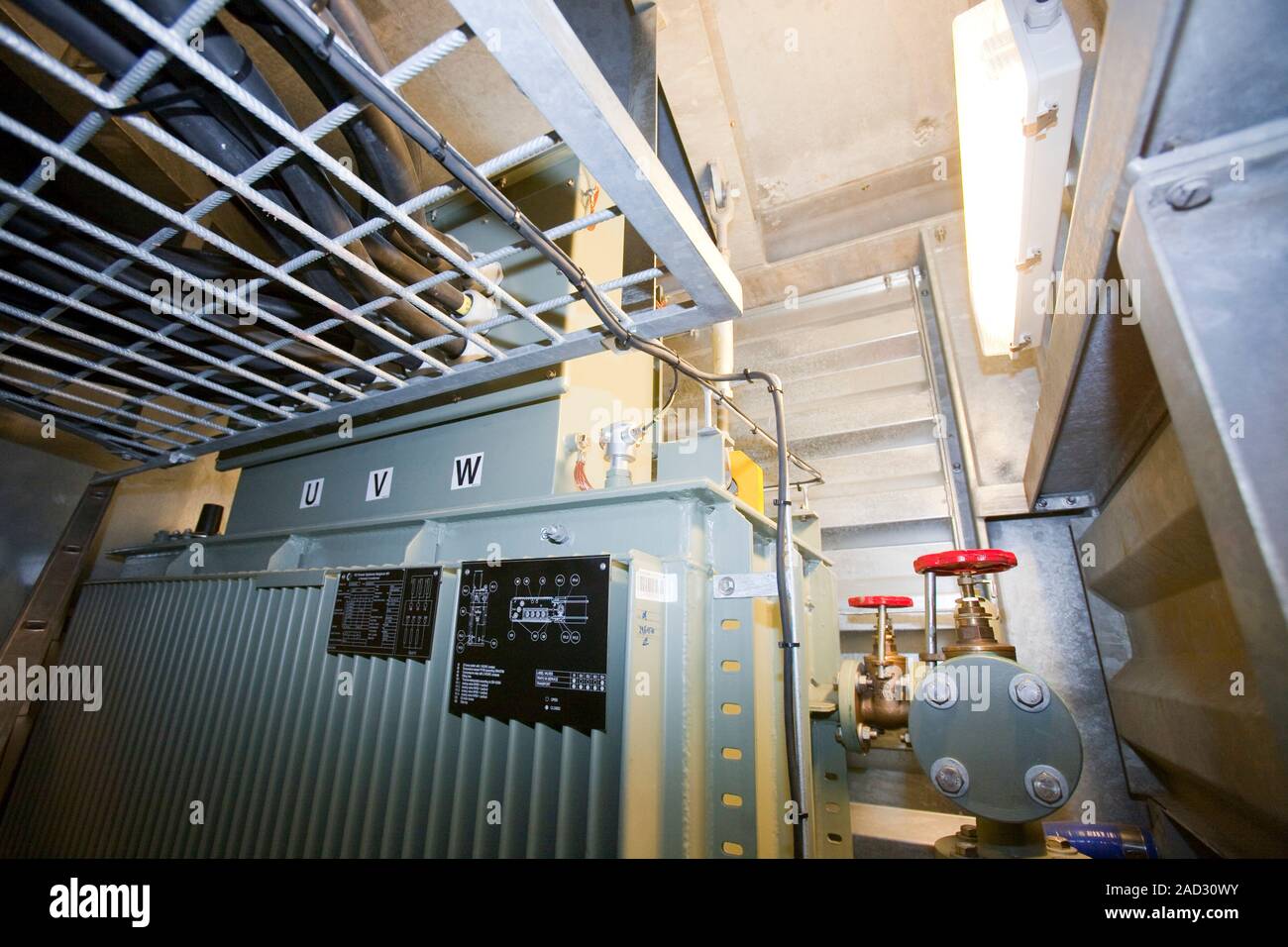 An electrical transformer inside an offshore wind turbine, destined for ...