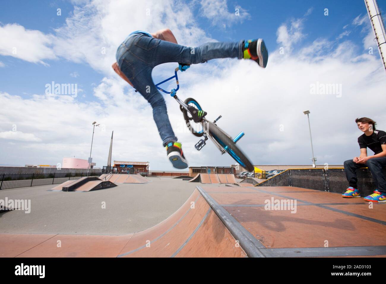 Teenage boys perform aerial stunts on BMX bikes at a BMX park in Rhyl ...