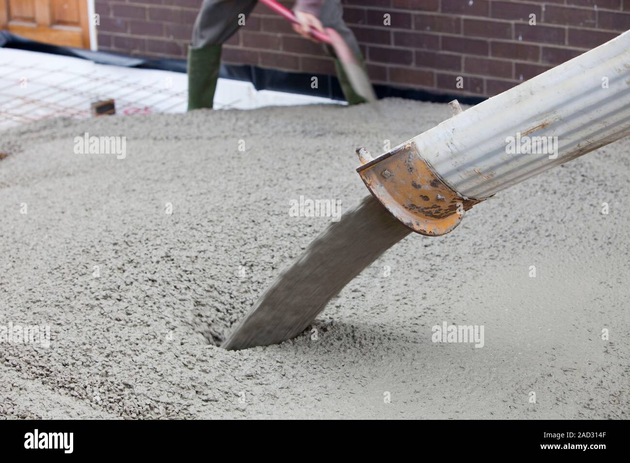 Pouring concrete for the floor of a house extension, Ambleside, UK ...
