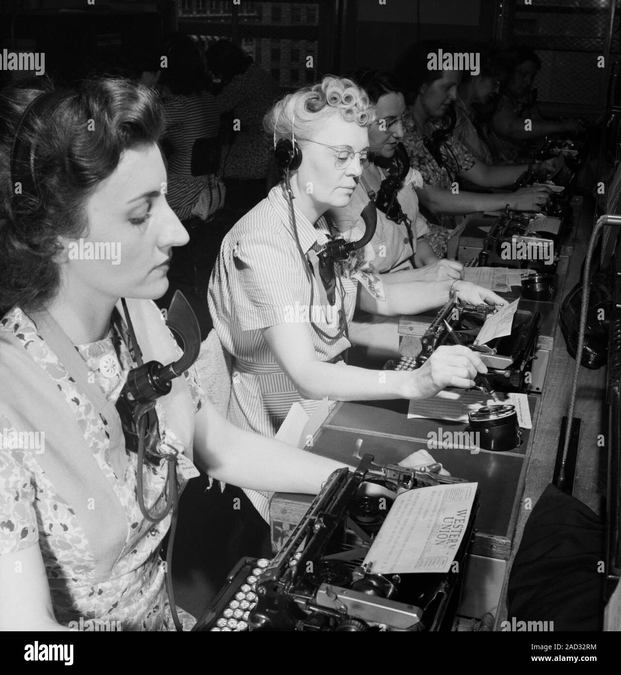 Telephone operators, 1940s. Women operating telephones and typewriters ...
