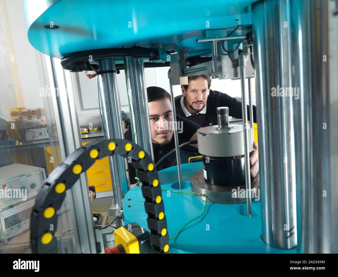 Forces measurement laboratory. Researchers working with an apparatus ...