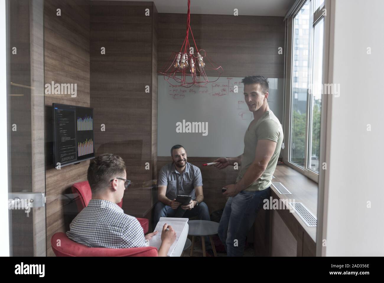 team meeting and brainstorming in small private office Stock Photo - Alamy