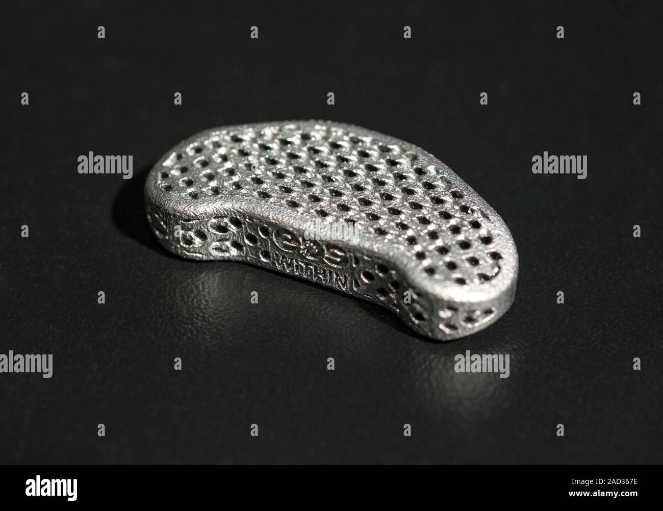 Editorial use only 3D printed spinal disc prosthesis. 3D printed ... Editorial use only 3D printed spinal disc prosthesis. 3D printed ...