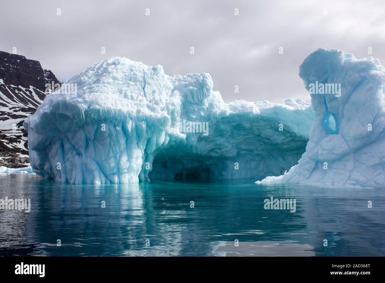 Iceberg cave. View of a cave formed in a large iceberg. Photographed in ...